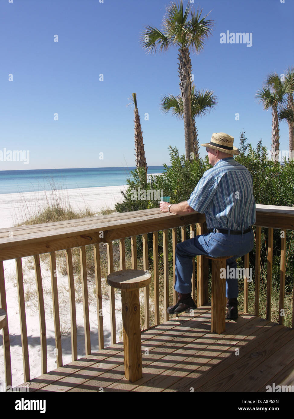 Man Looking Out at Beach Stock Photo - Alamy