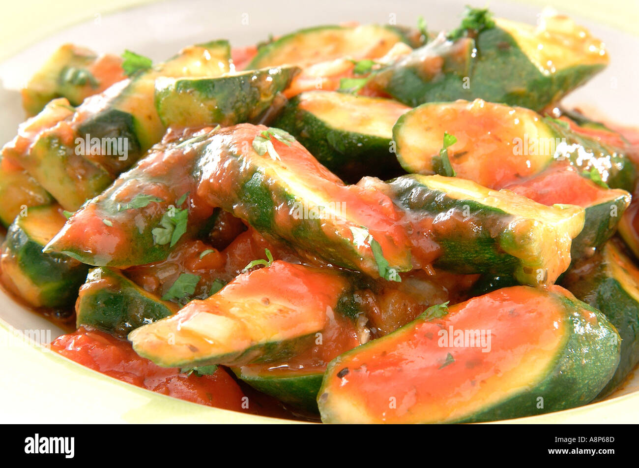 sliced courgettes in tomato sauce Stock Photo - Alamy