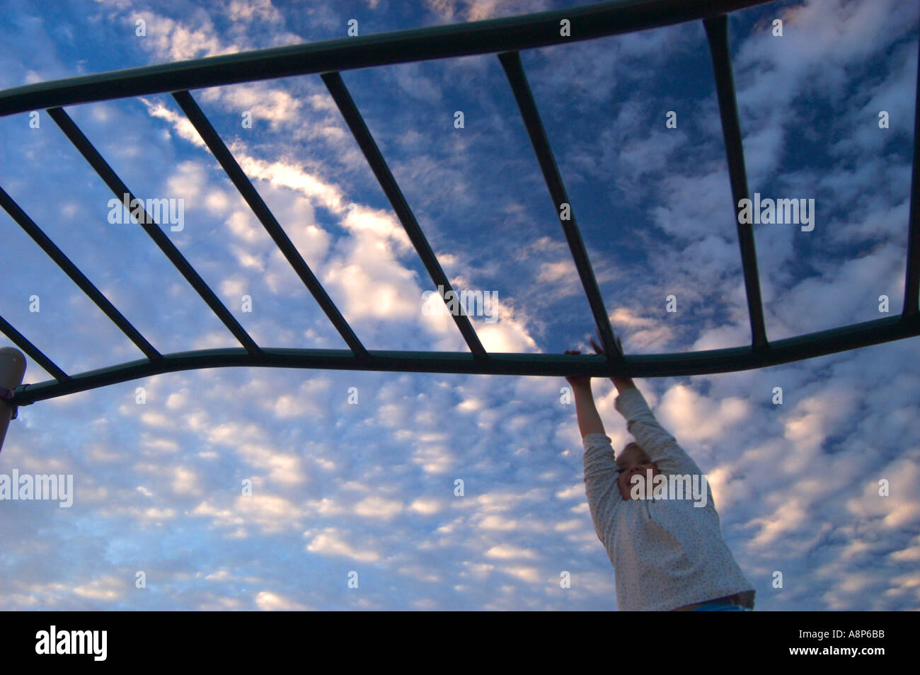 playing on playground bars Stock Photo - Alamy