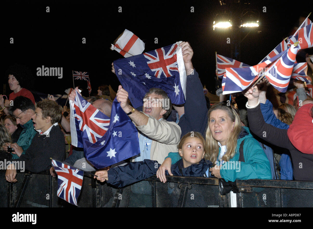 Patriotic fans at an outdoor prom in Hyde Park London waving national ...