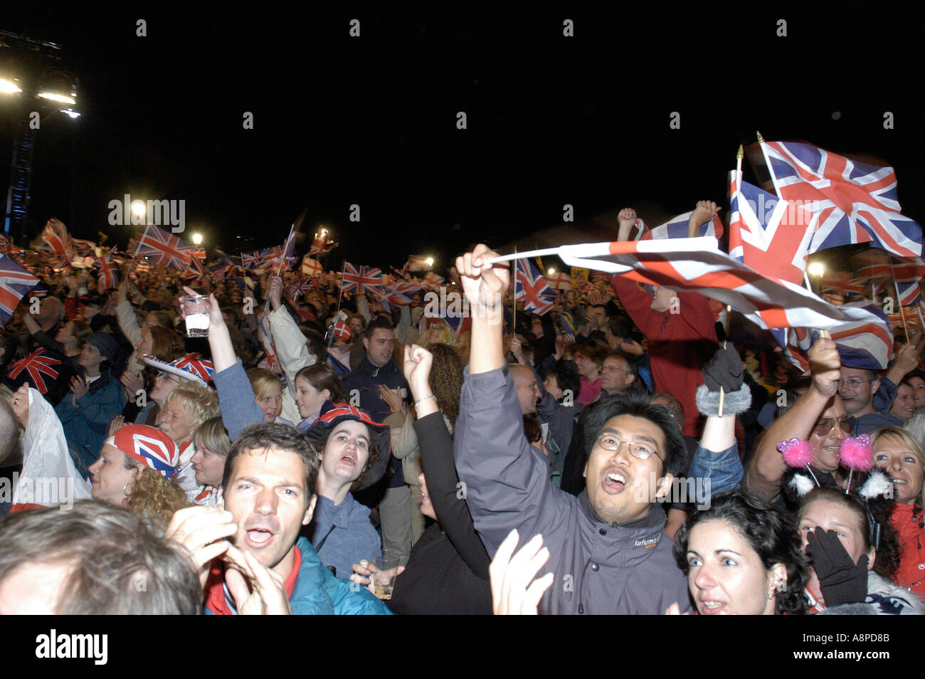 Patriotic fans at an outdoor prom in Hyde Park London waving national ...