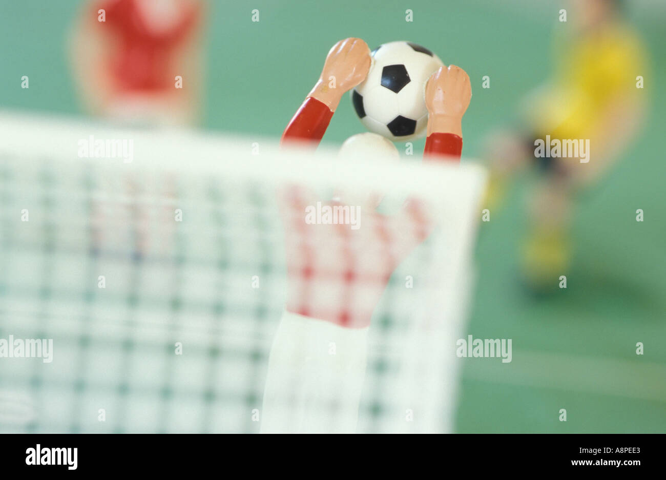 Toy figurine playing football, Tipp Kick Stock Photo - Alamy