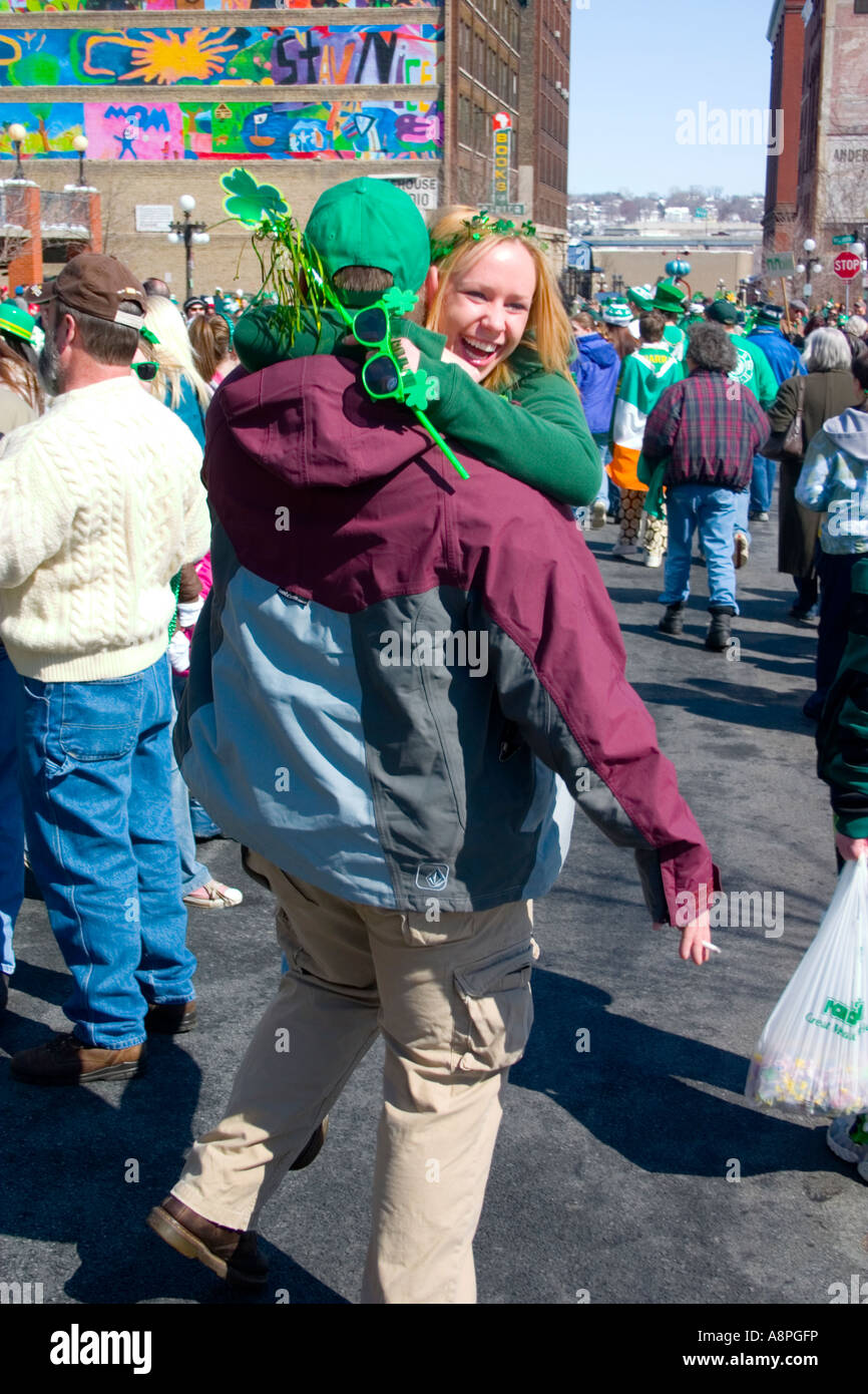 St. Patrick's Day parade participants hugging and having fun. St Paul ...