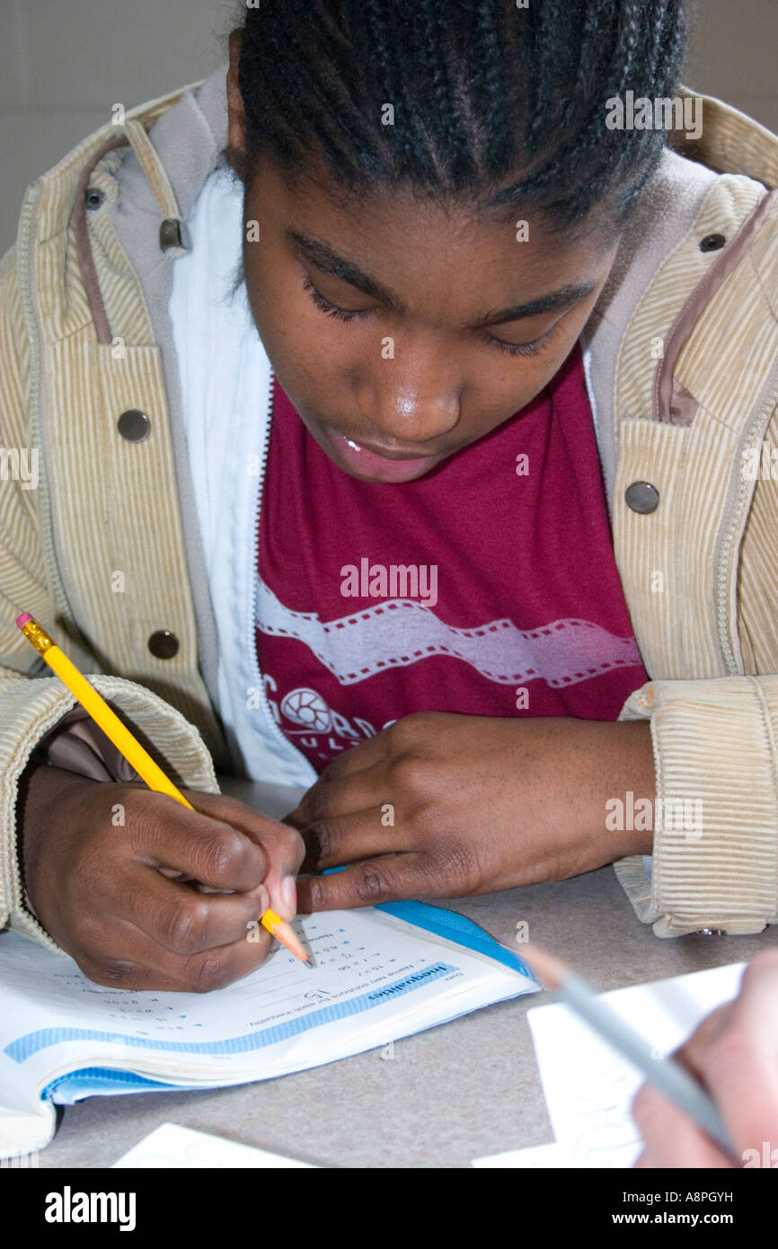 Student working on homework after school. After School Study Program ...