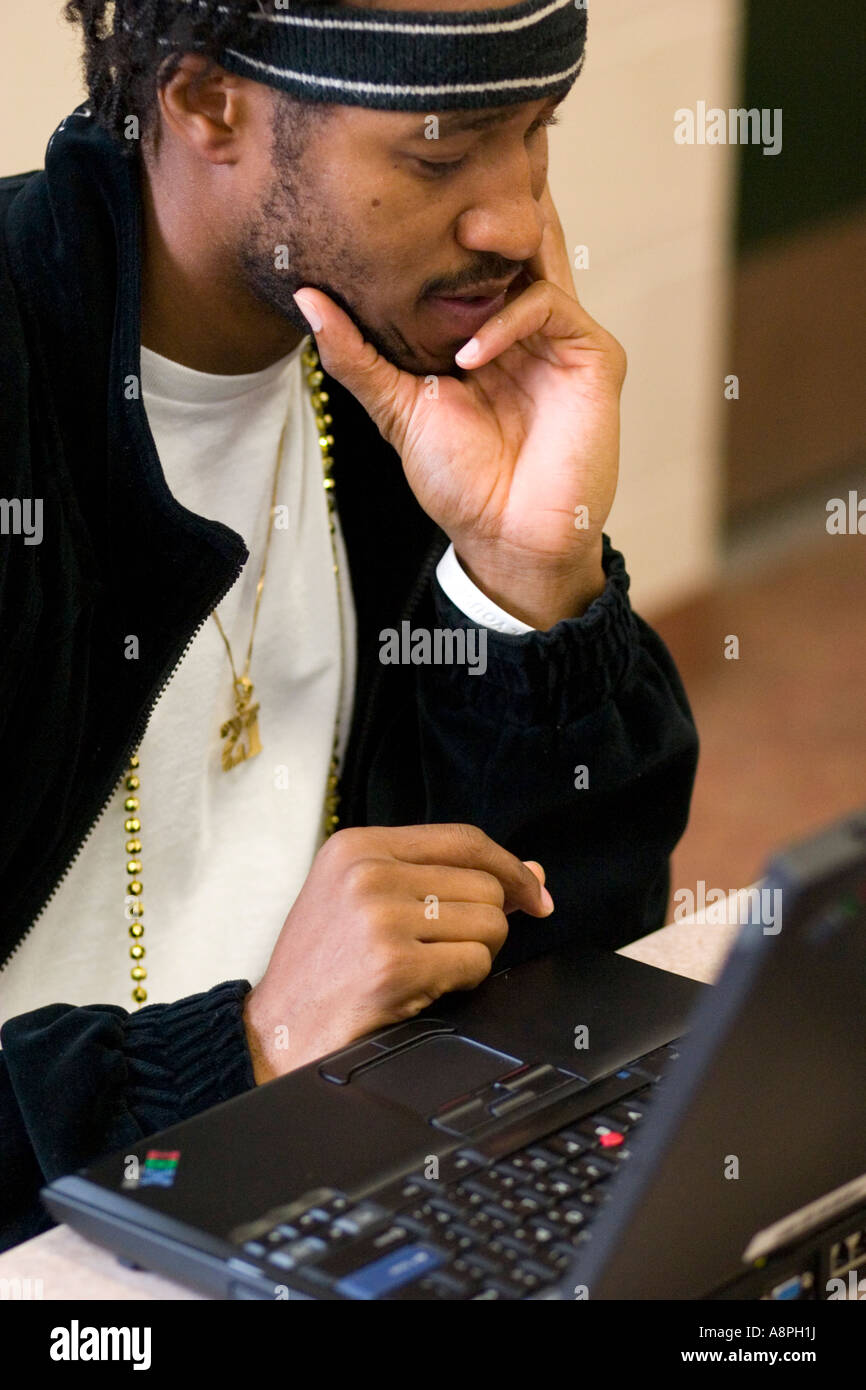 Inner city teacher working on a laptop computer. After School Study ...