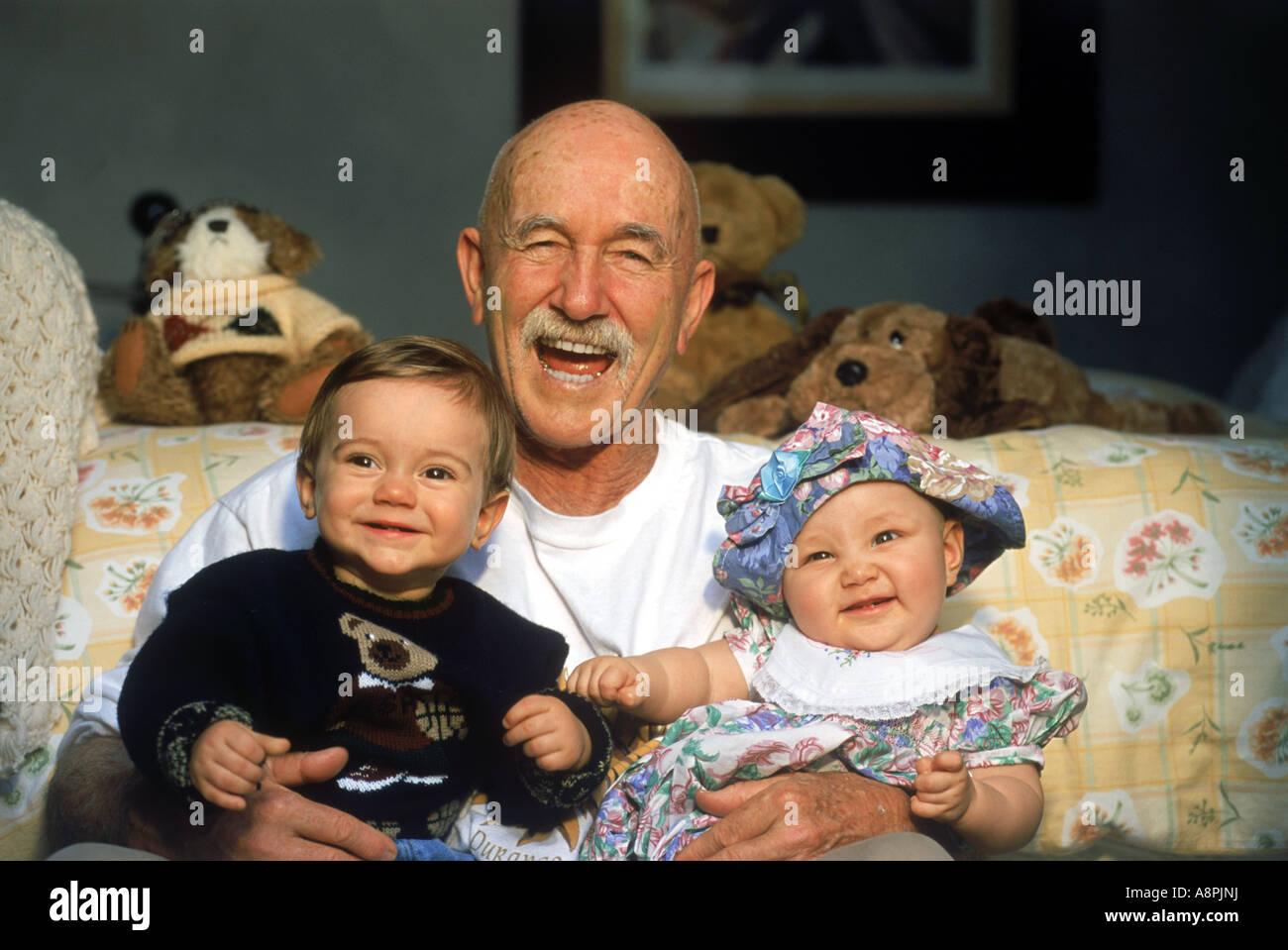 Family grandfather bed grandchild hi-res stock photography and images ...