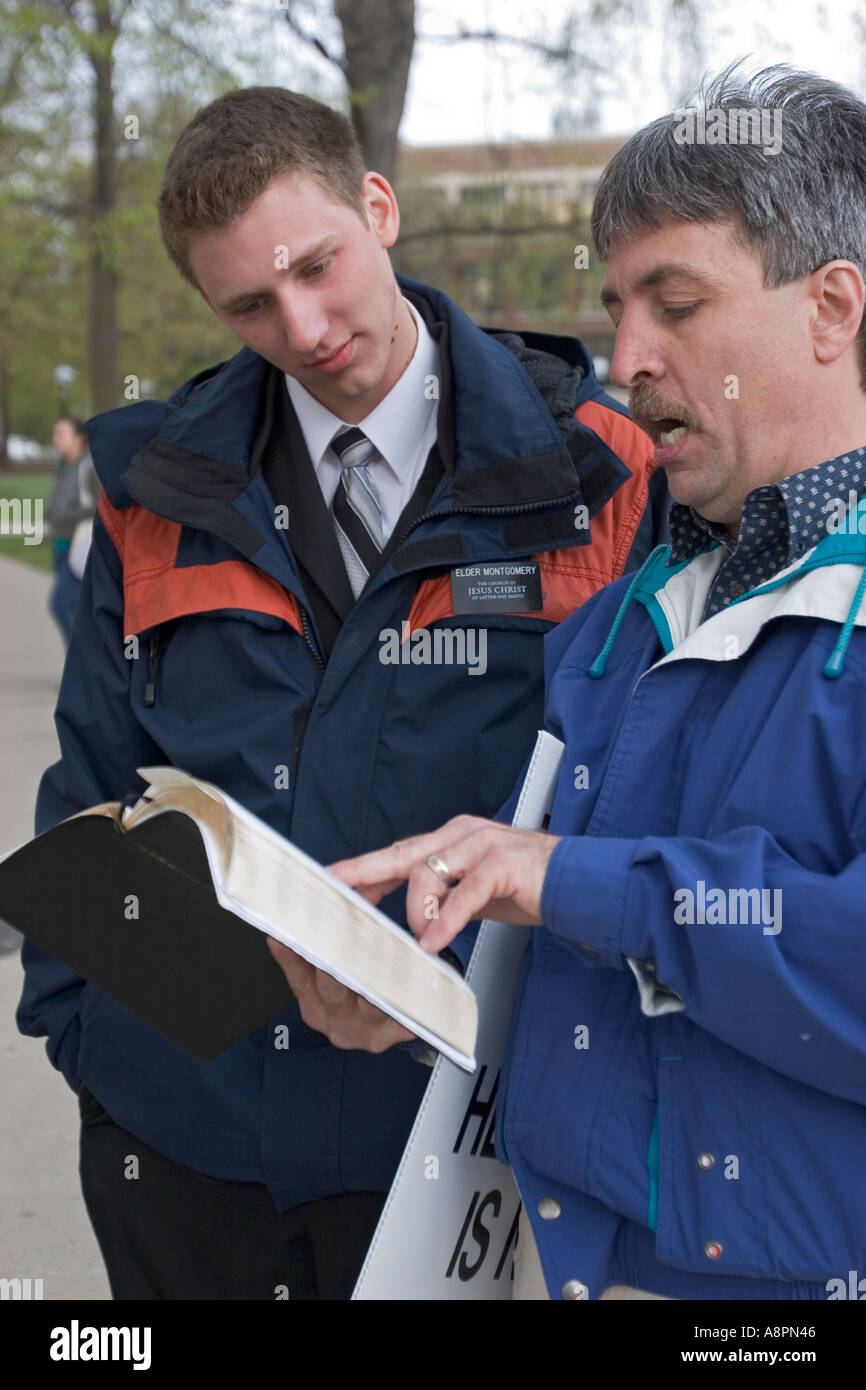 Street Preacher Debates Mormon Missionary Stock Photo - Alamy