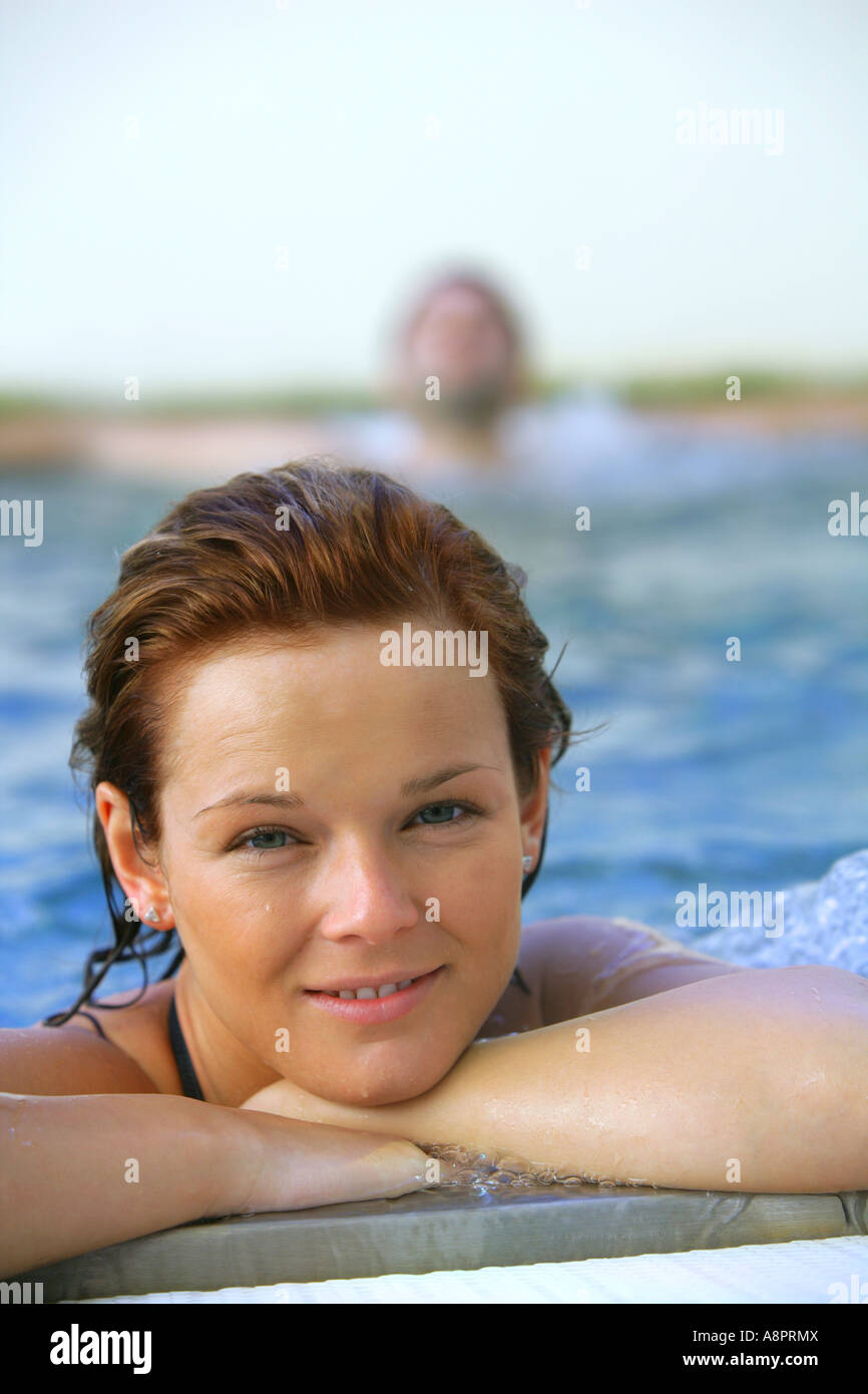 couple relaxing in whirl pool Stock Photo - Alamy
