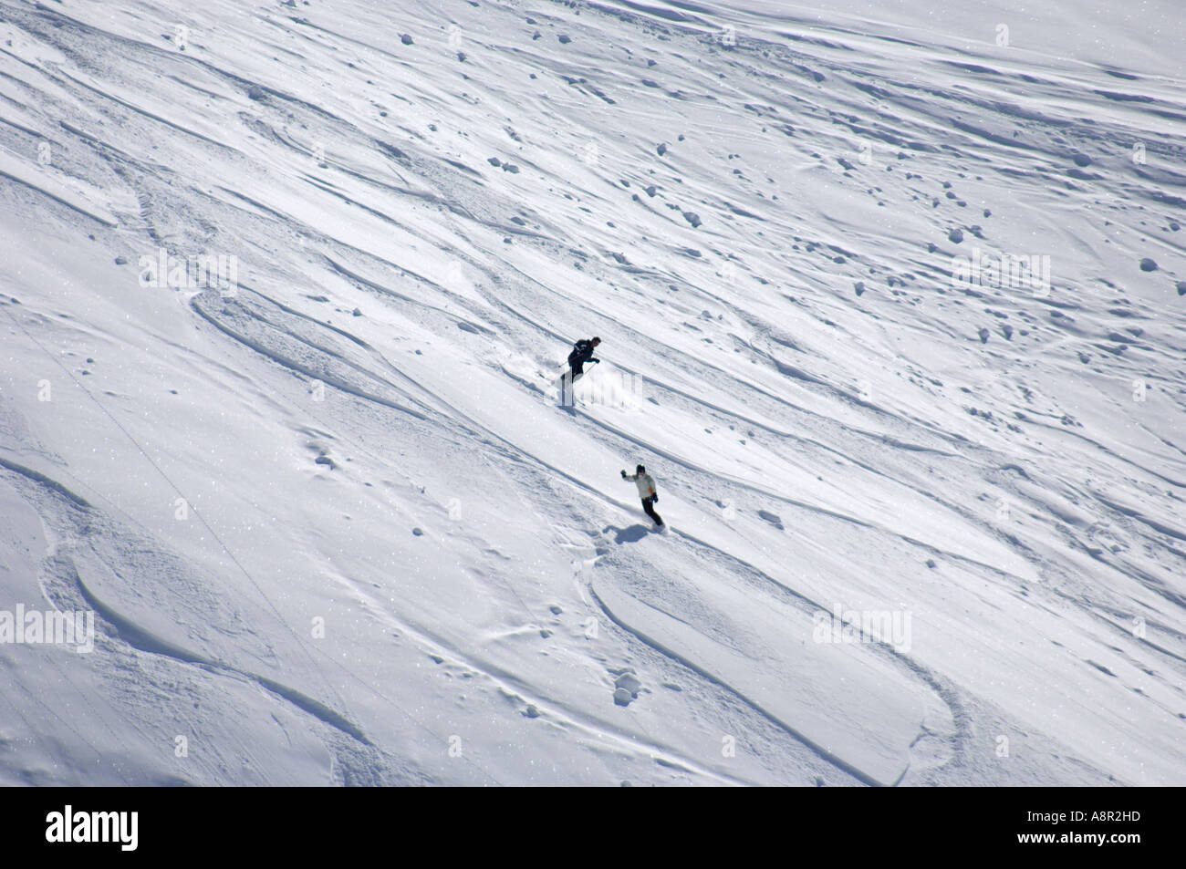Skier descending steep slope hi-res stock photography and images - Alamy