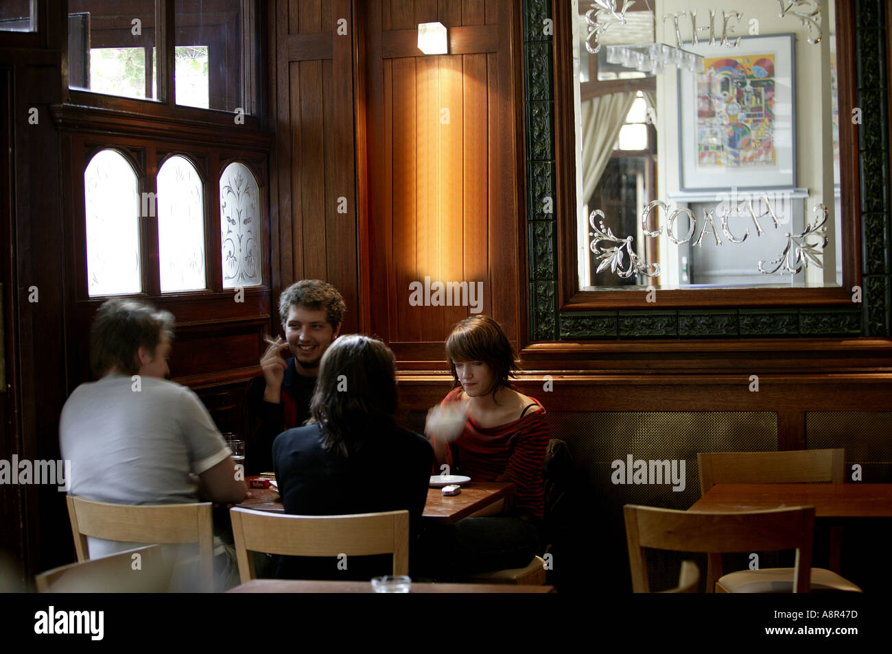 PEOPLE EATING AND DRINKING IN A BAR Stock Photo - Alamy