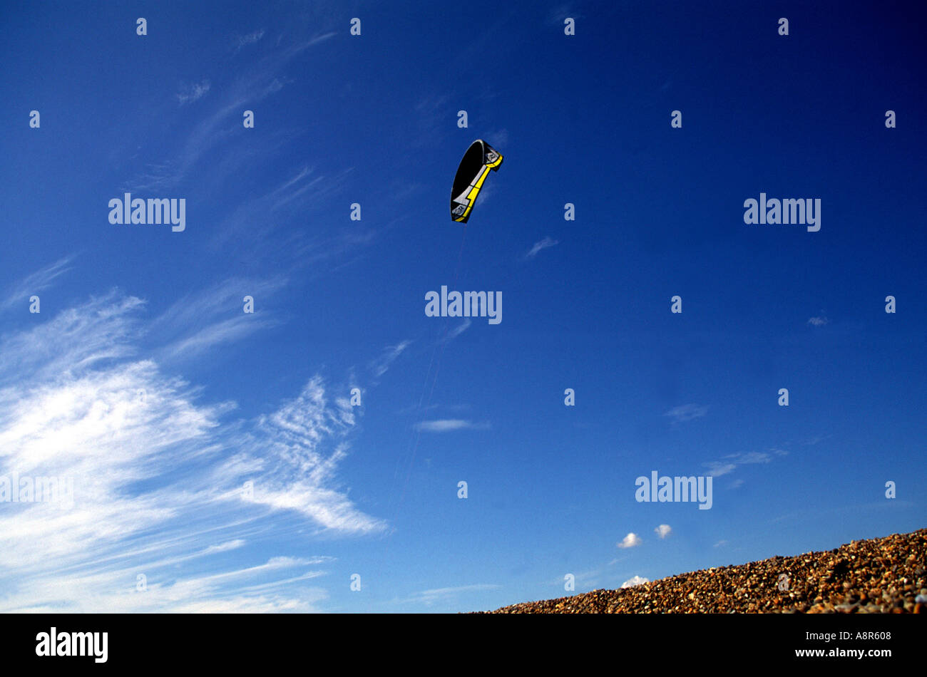 Sports kite flying high in deep blue sky Stock Photo - Alamy