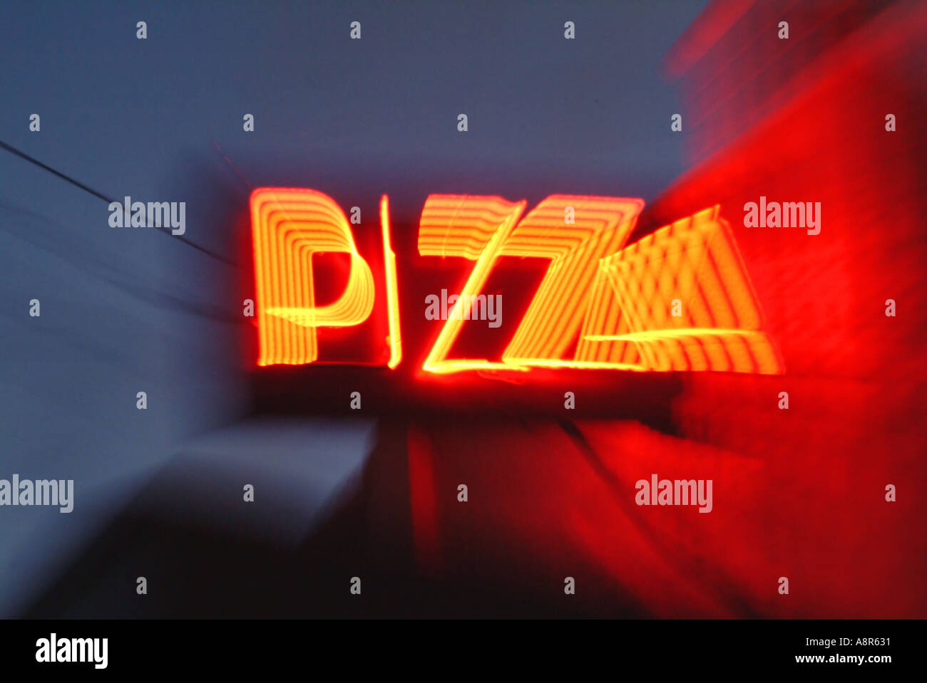 Pizza neon sign slow shutter speed zoom blur Stock Photo - Alamy