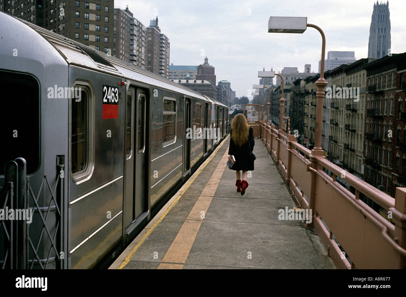 A woman walks on the platform of the Line 1 subway at 125th Street and ...