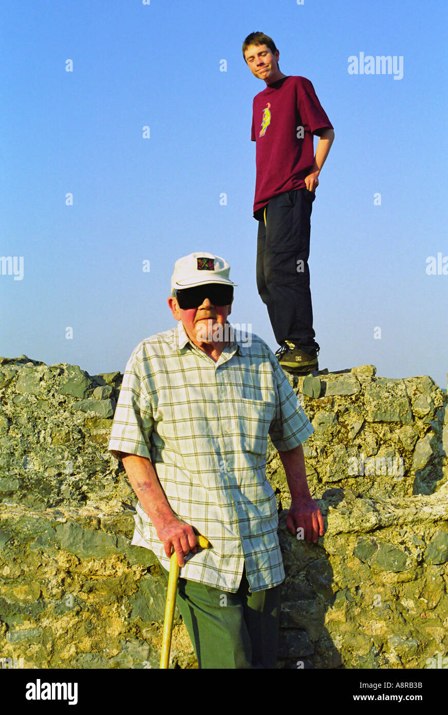 elderly man with teenage boy Stock Photo - Alamy