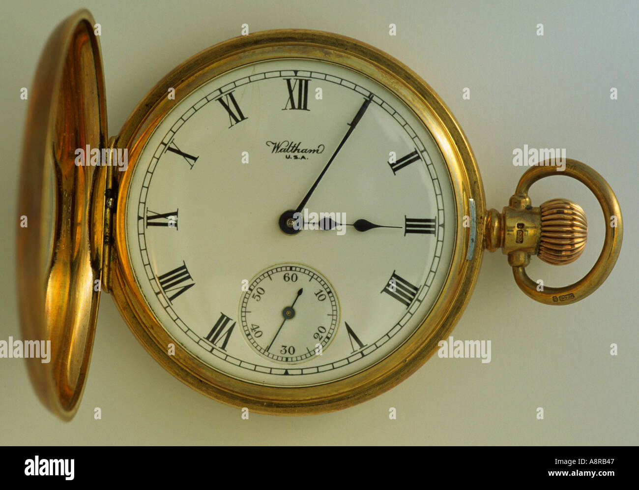 Gold pocket watch Stock Photo - Alamy