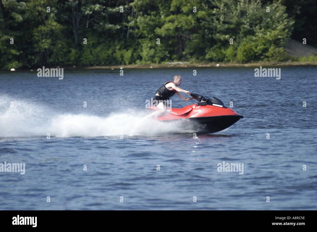 Man going fast on Jet Ski Stock Photo - Alamy