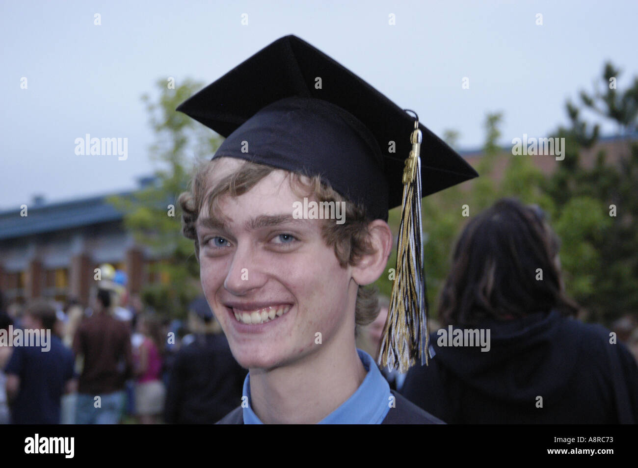 Male highschool graduate at graduation ceremonies Stock Photo - Alamy