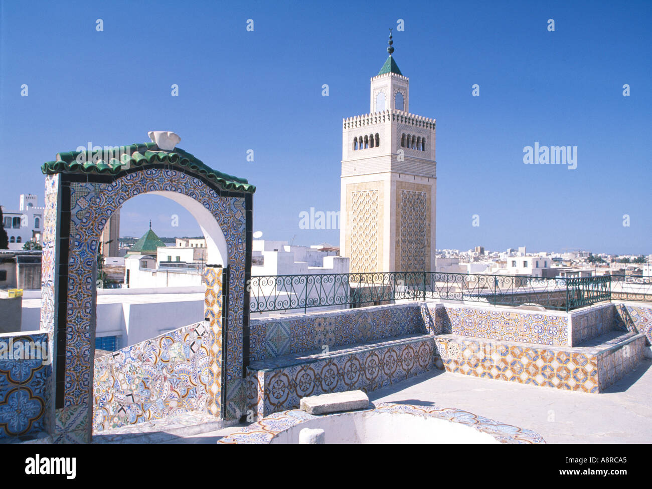 The buildings of the Medina dominated by the square minaret of the ...