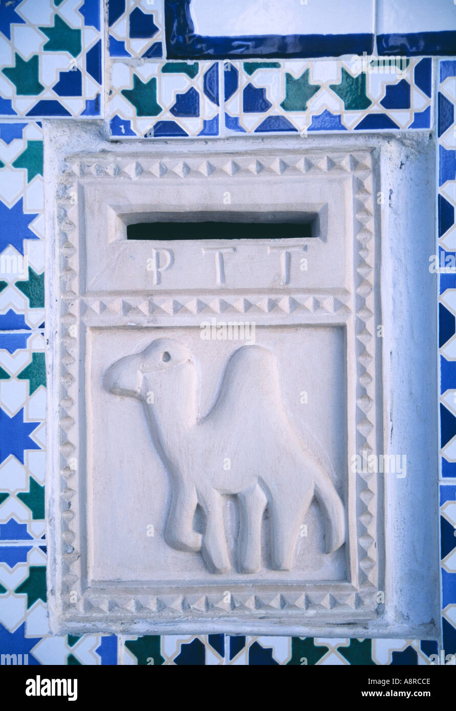 Detail of the relief of a camel decorating a post box set amongst ...