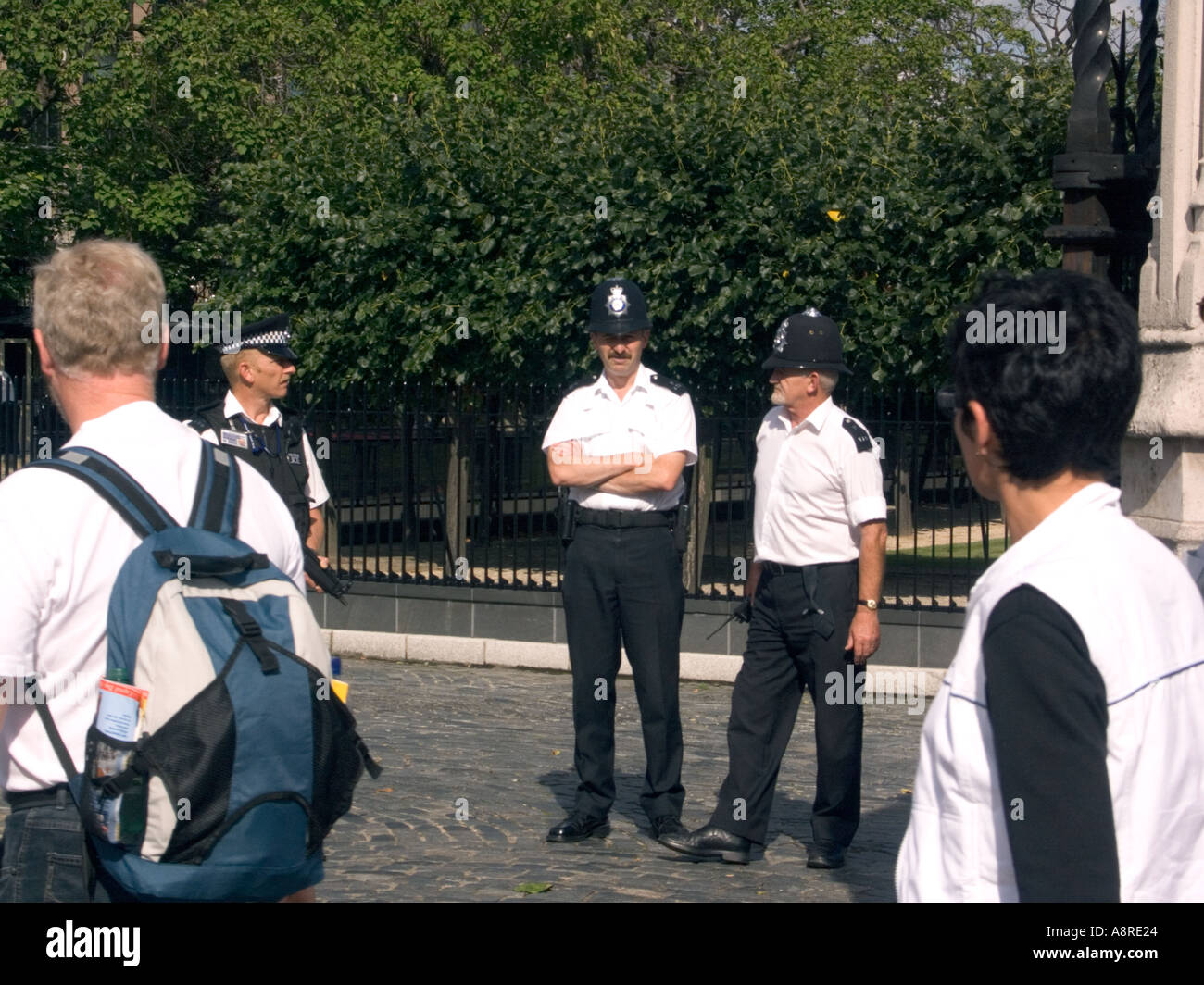 Armed Police officers guard the Houses of Parliament London England ...