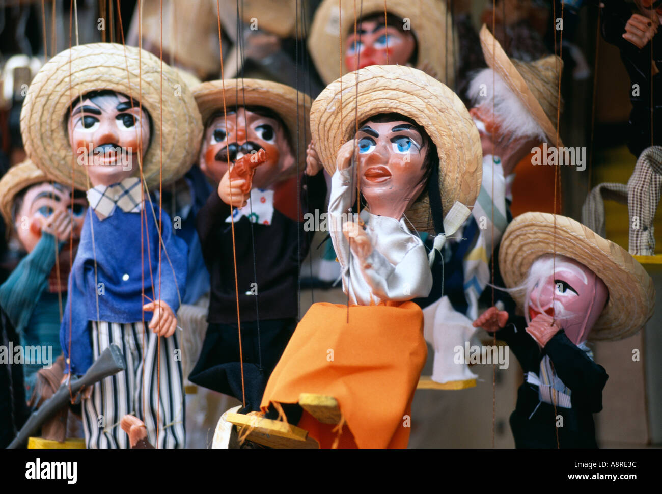 Detail of colourful puppets on display at Mexican market stall in ...