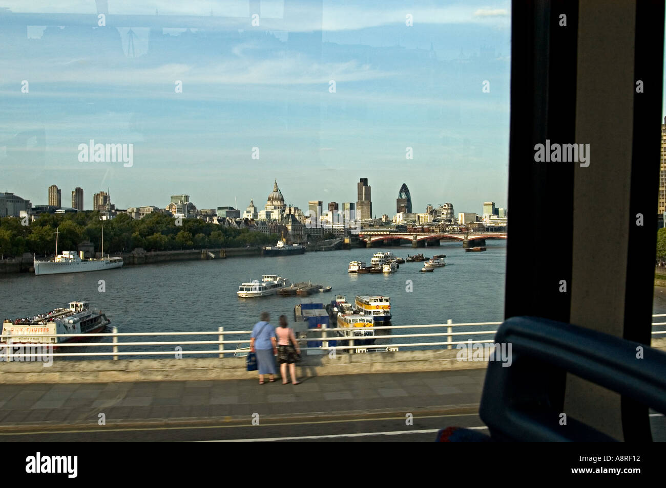 London bus top floor window view of River Thames and London cityscape ...