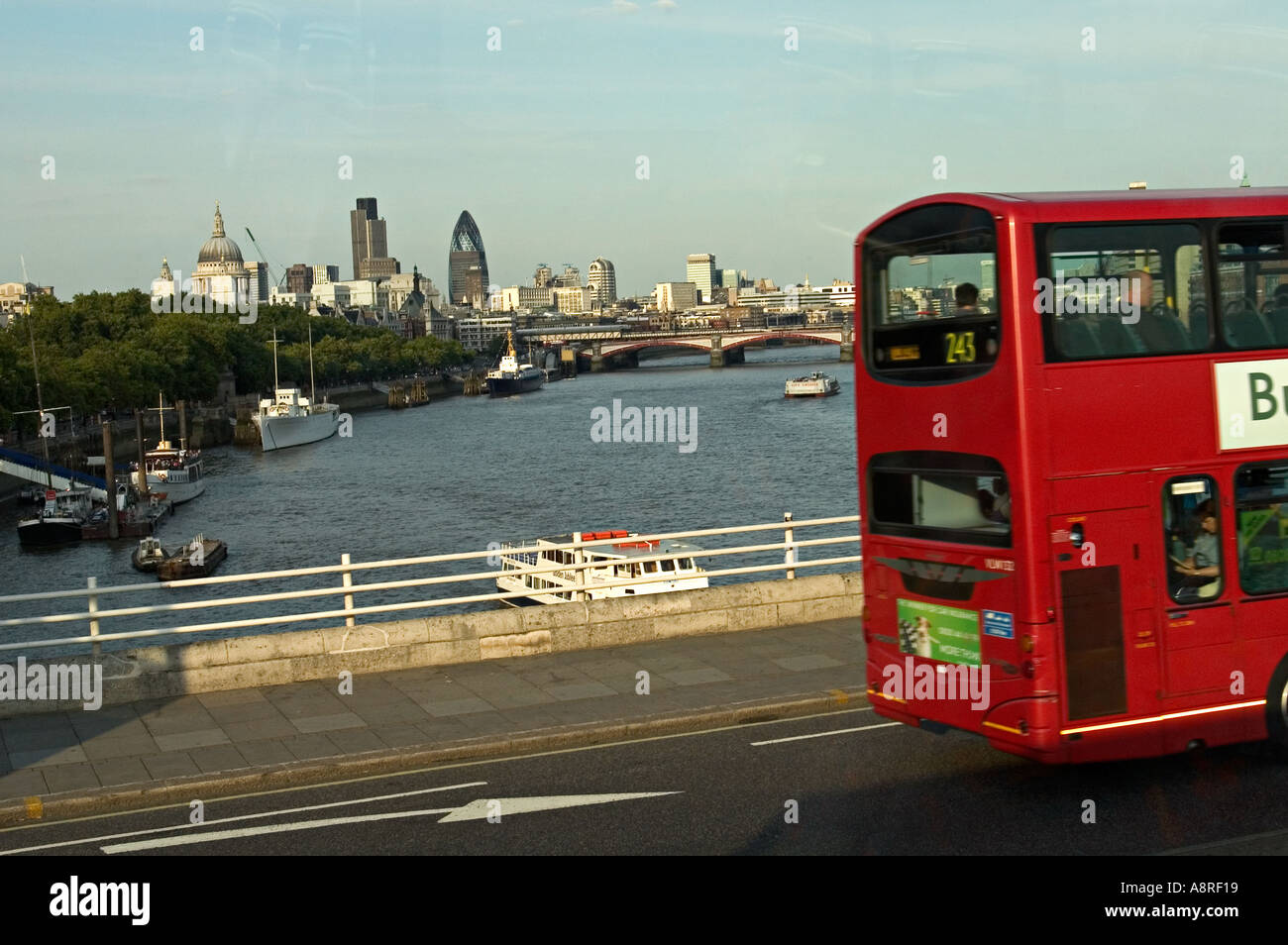 London bus top floor window view of River Thames and London cityscape ...