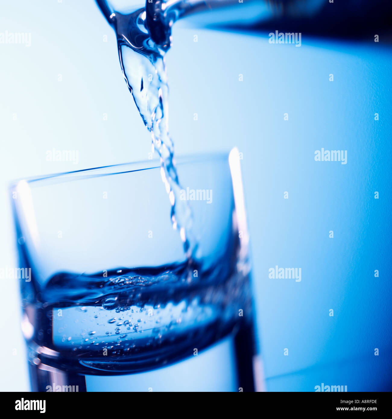 Water pouring into glass Stock Photo - Alamy