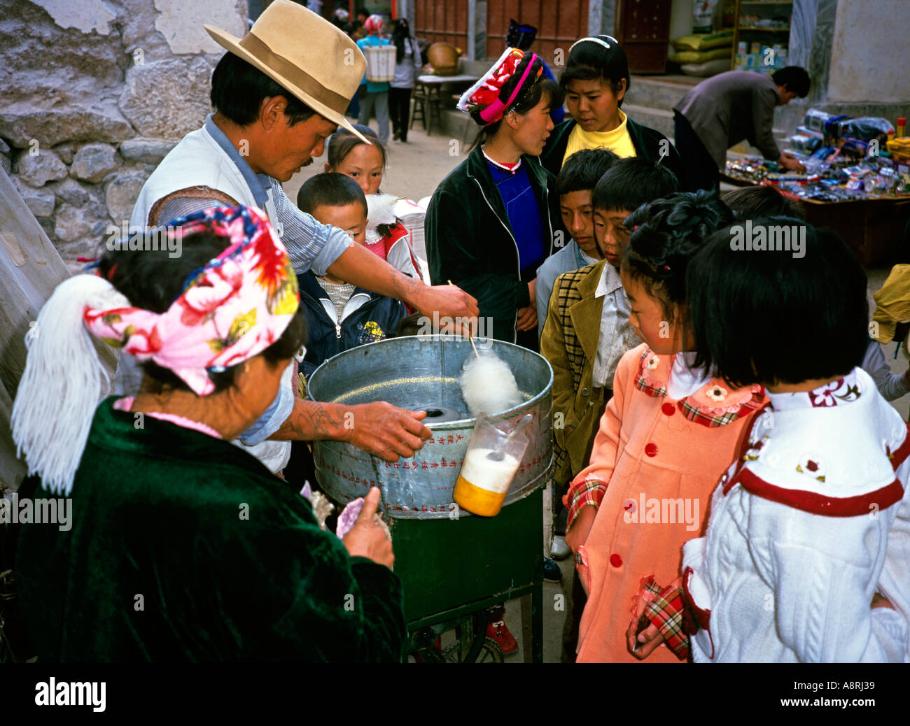 China Yunnan Dali Wase man making candy floss Stock Photo - Alamy