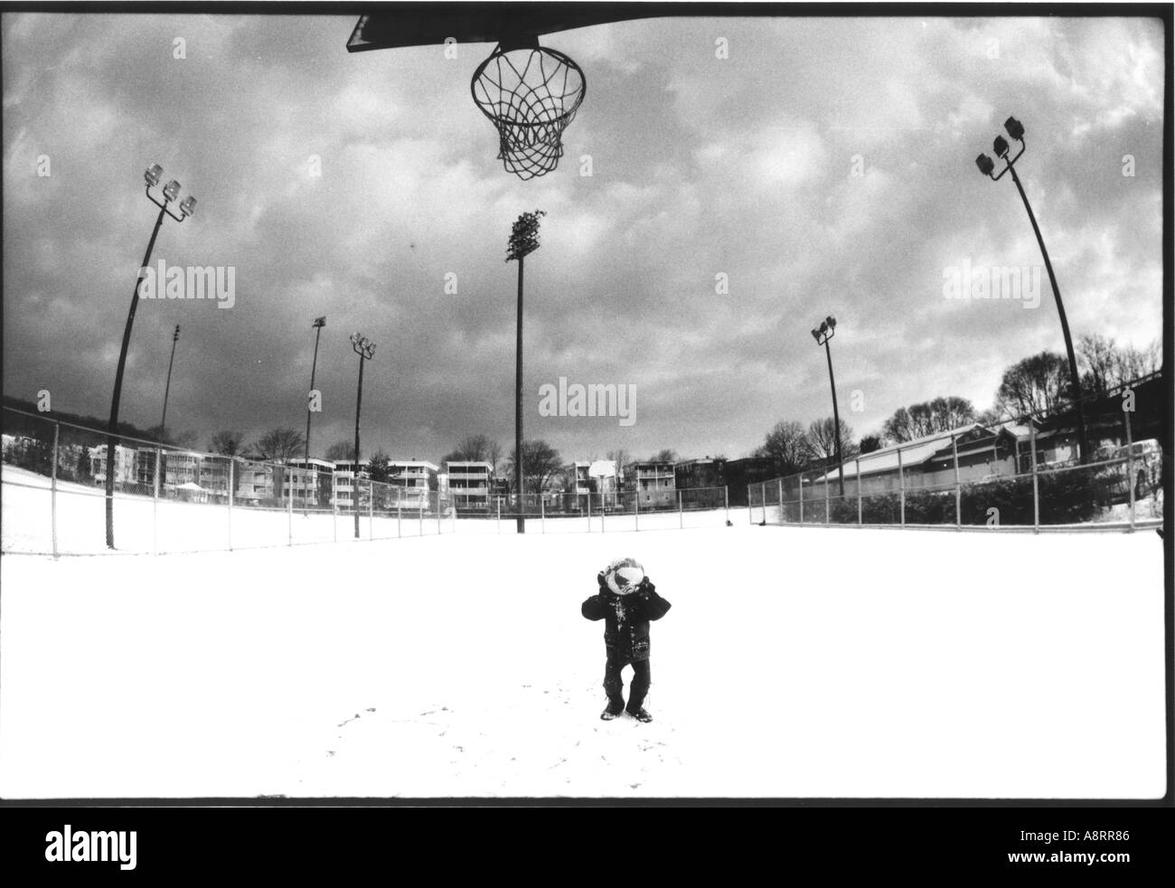 Six year old African American boy playing basketball in the snow Stock ...