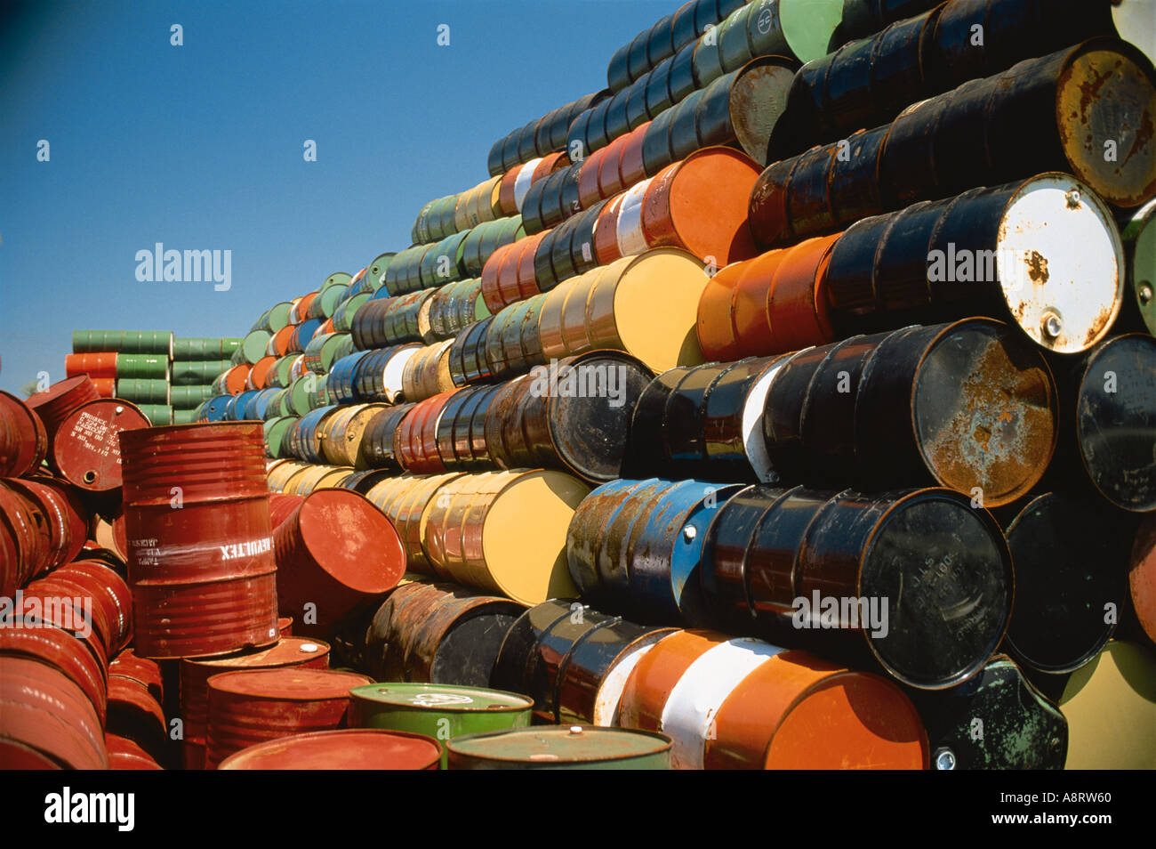 Stock pile of many multicolored oil drums Stock Photo - Alamy