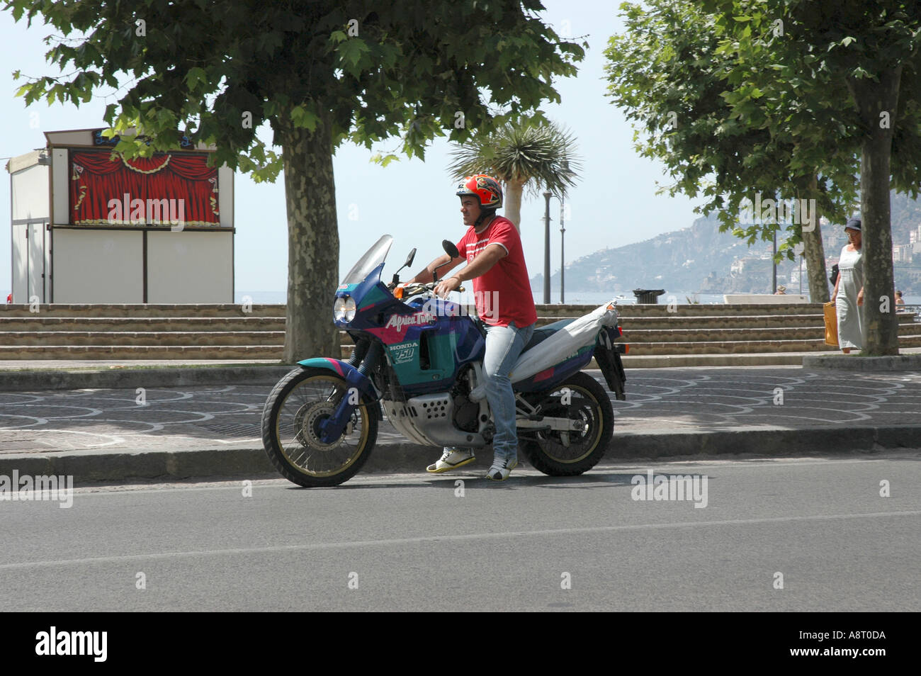 Typical italian street scene vespa hi-res stock photography and images ...