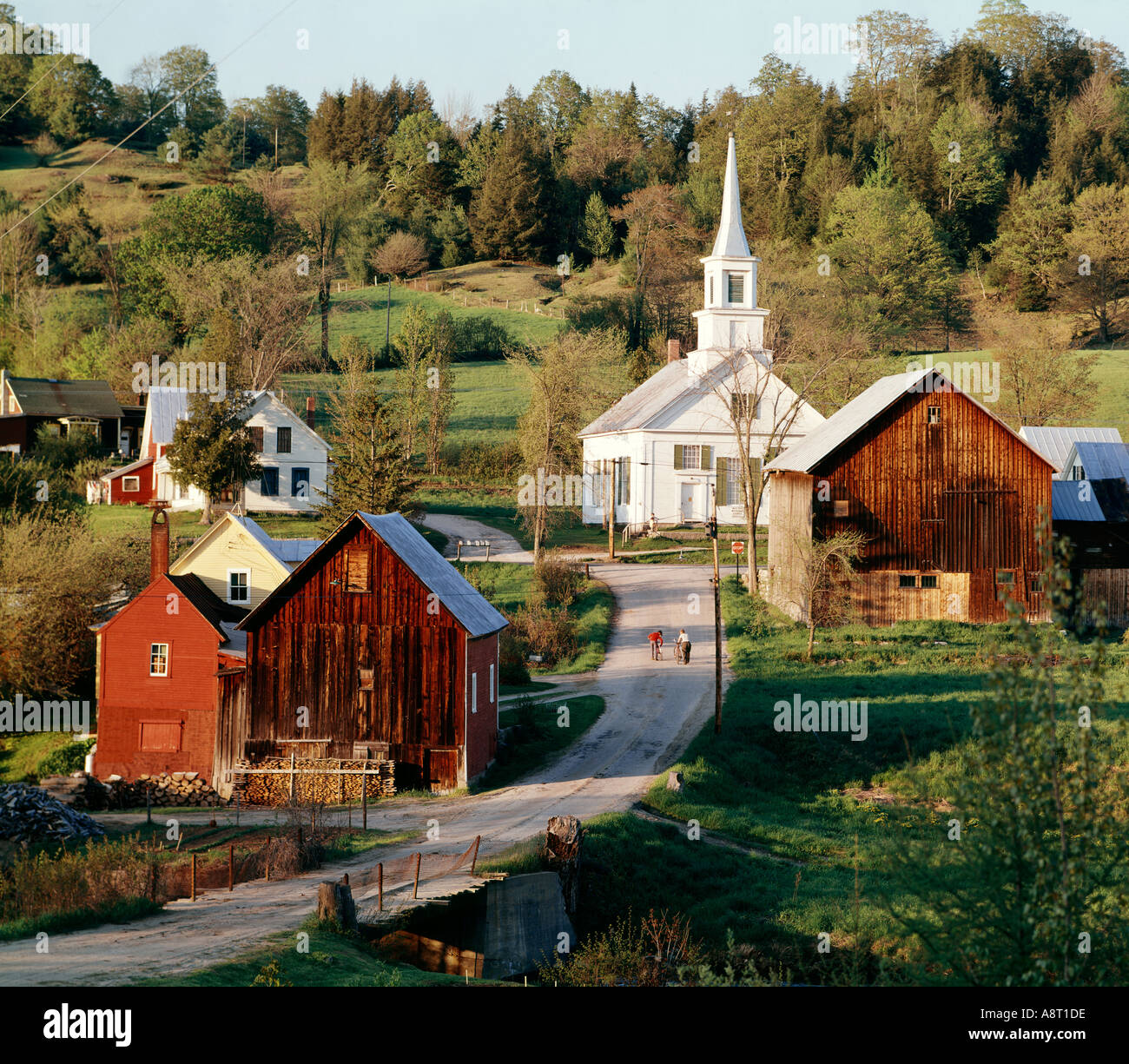 Tiny Village of Waits River in rural Vermont with two boys walking up a ...