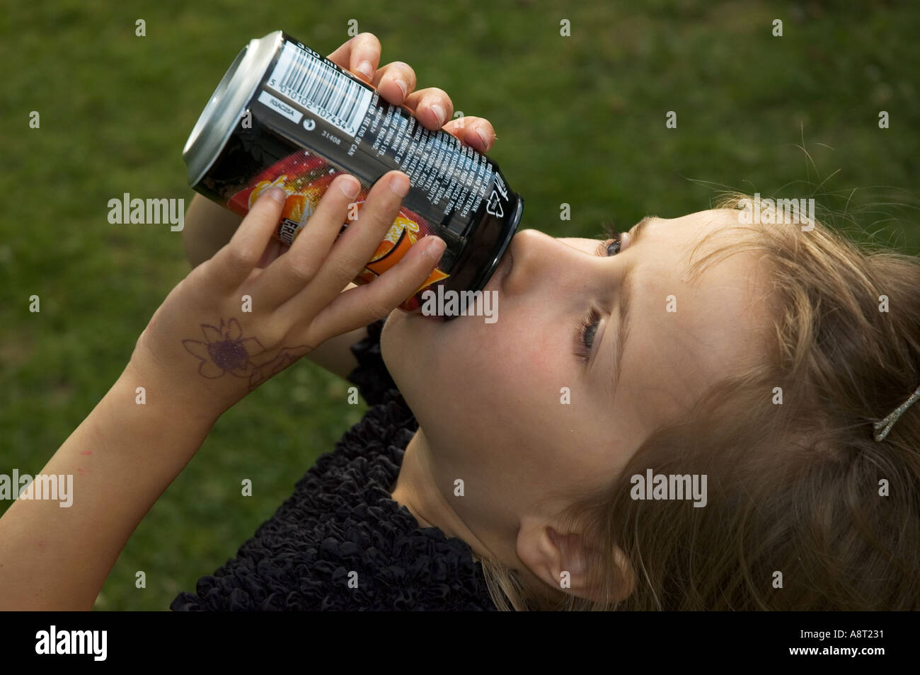 girl drinking can of pop Stock Photo - Alamy