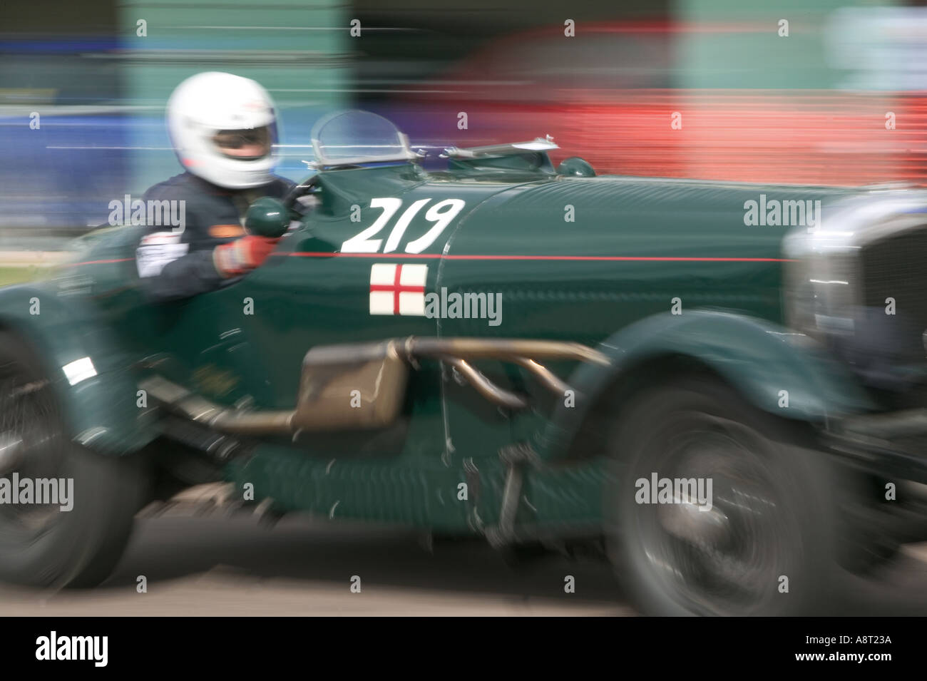 A green Bentley Royce V12 8000 cc vintage racing car accelerates at ...
