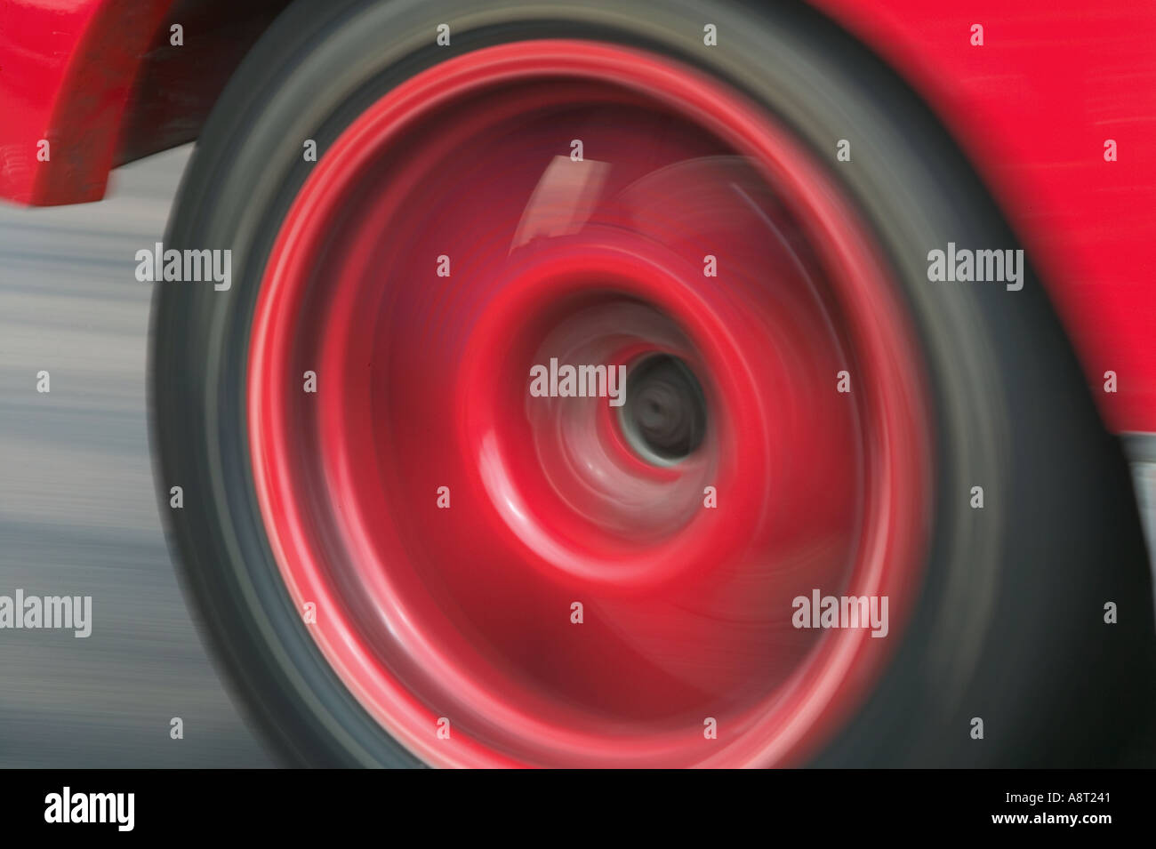 Moving red wheel of a vintage racing car Stock Photo - Alamy