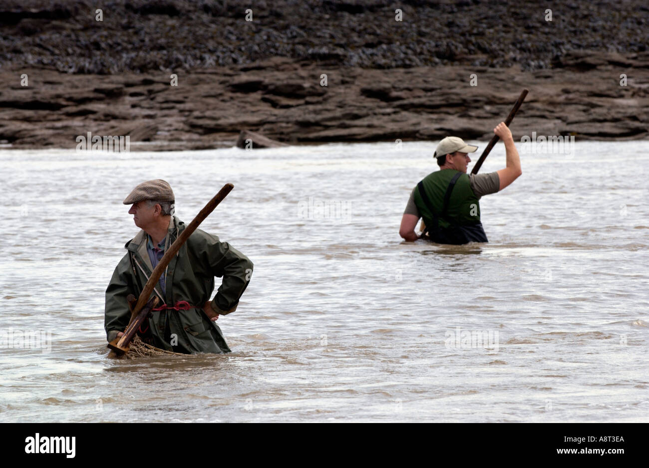 Local men fishing for salmon using a traditional Lave Net on the ebbing ...
