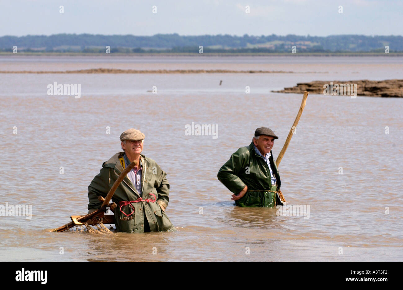 Local men fishing for salmon using a traditional Lave Net on the ebbing ...