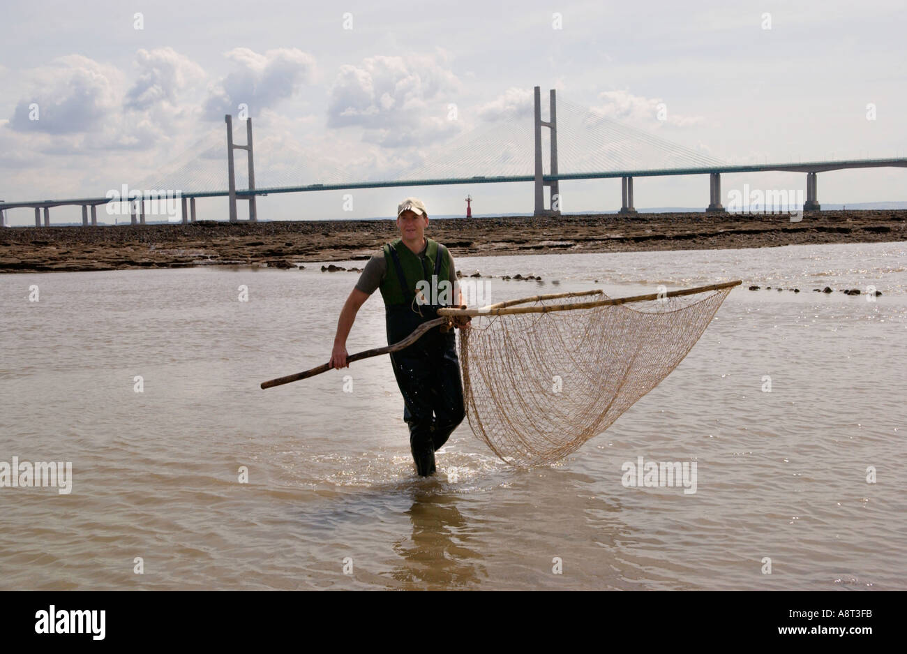 Local men fishing for salmon using a traditional Lave Net on the ebbing ...