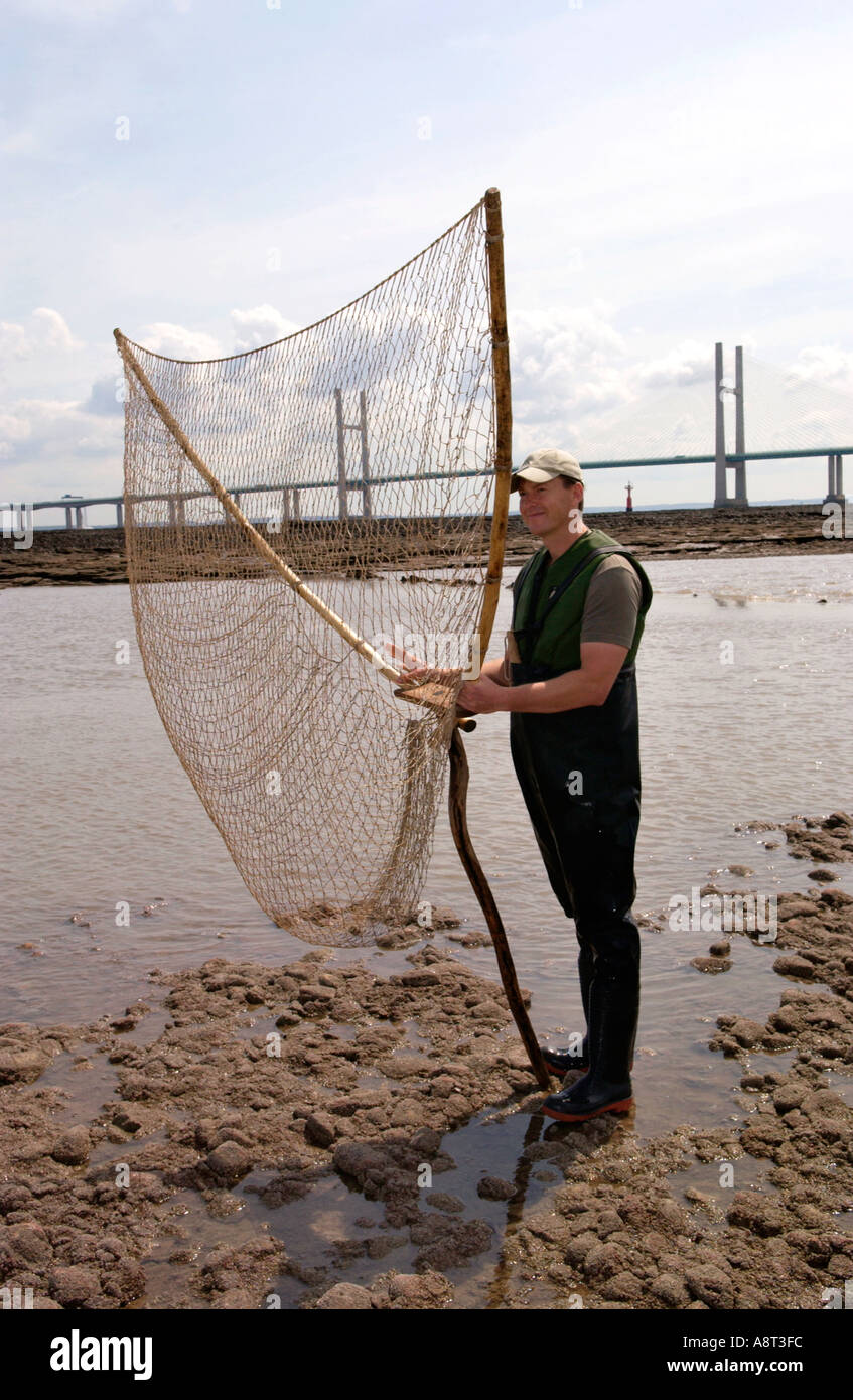 Local men fishing for salmon using a traditional Lave Net on the ebbing ...