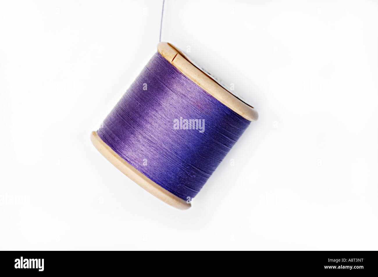 Spool of Dark Lilac Mercerised Cotton Thread Stock Photo - Alamy