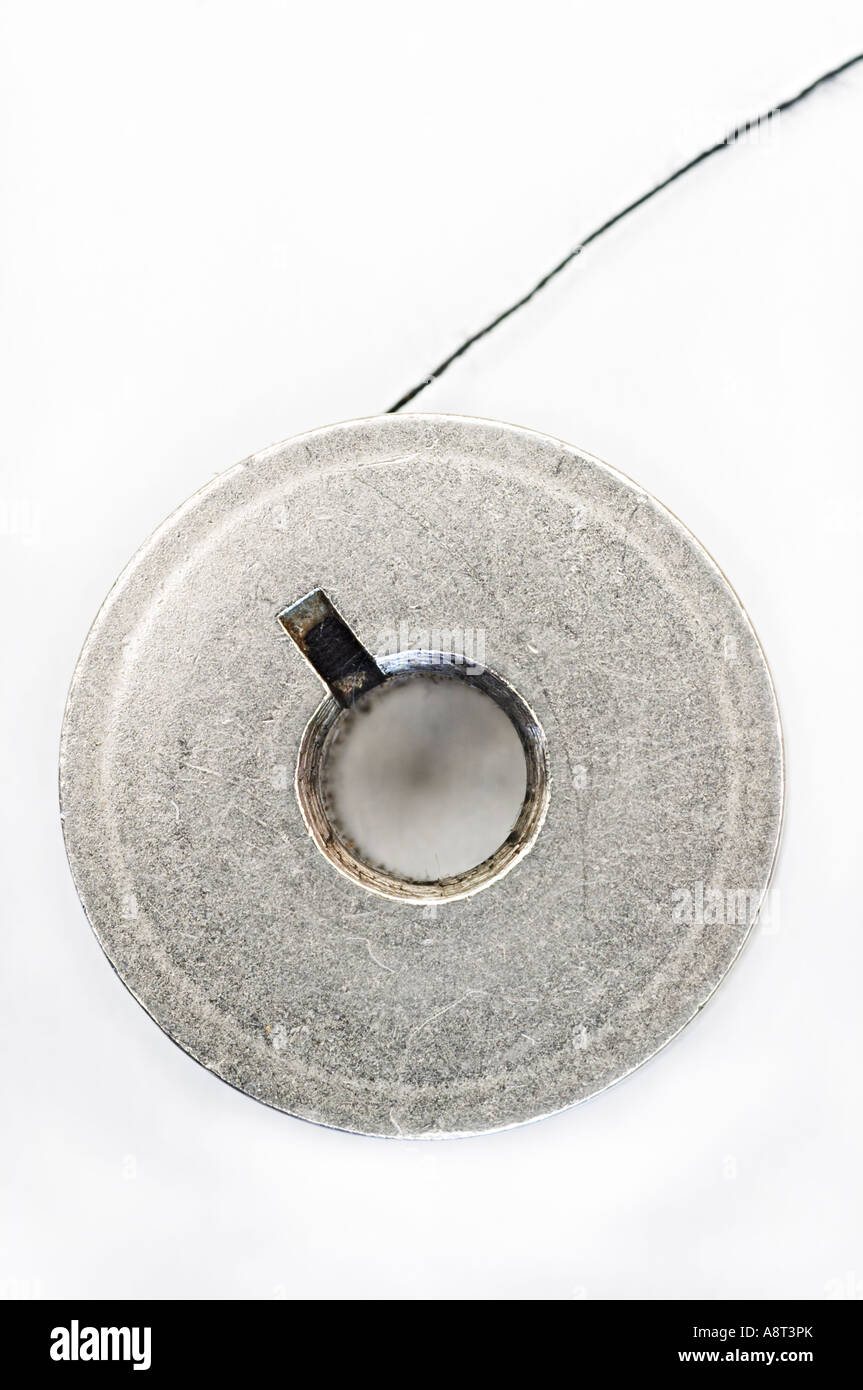 Steel Industrial Sewing Machine Bobbin with Black Thread Stock Photo ...