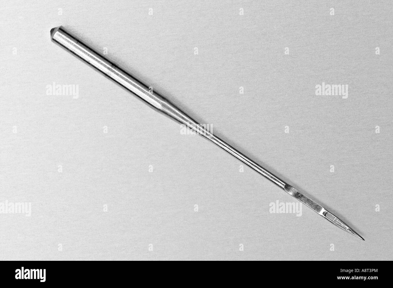 Steel Industrial Sewing Machine Needle on Brushed Aluminium Background ...