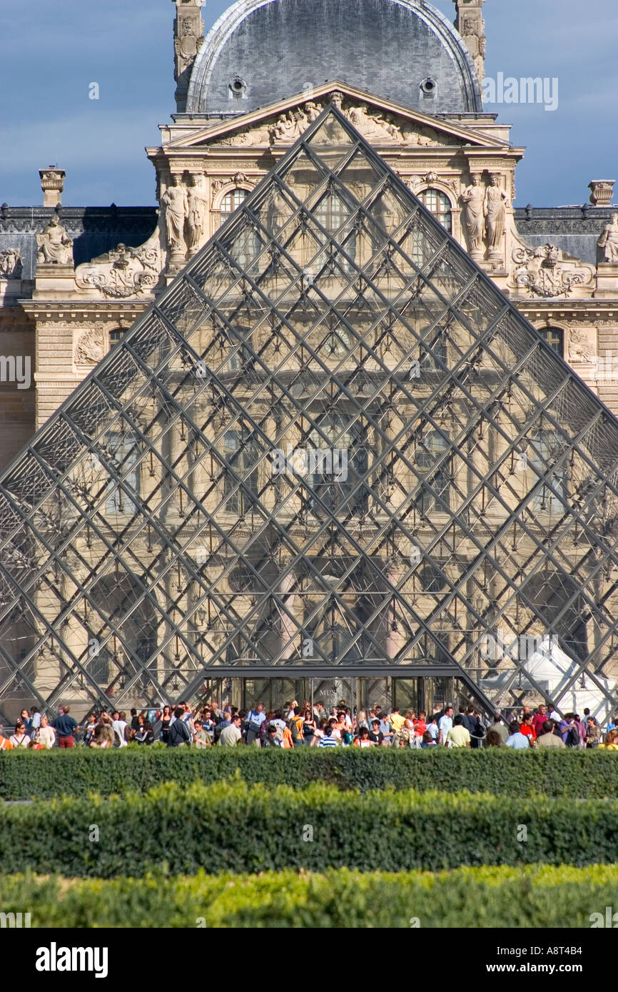 Tourist crowds by Louvre Museum Glass Pyramid entrance and surrounding ...