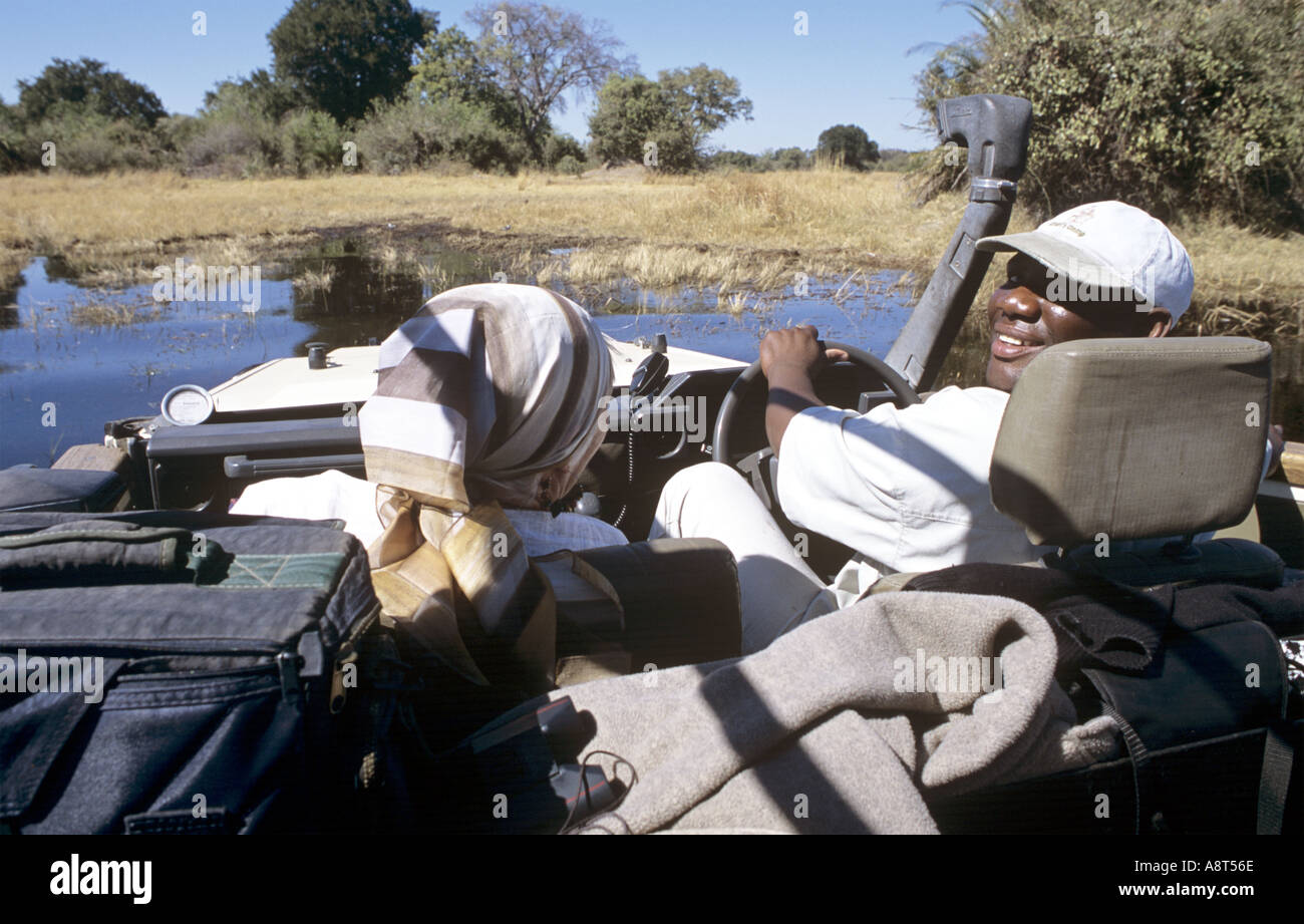 Driving through an Okavango flood Botswana Stock Photo - Alamy