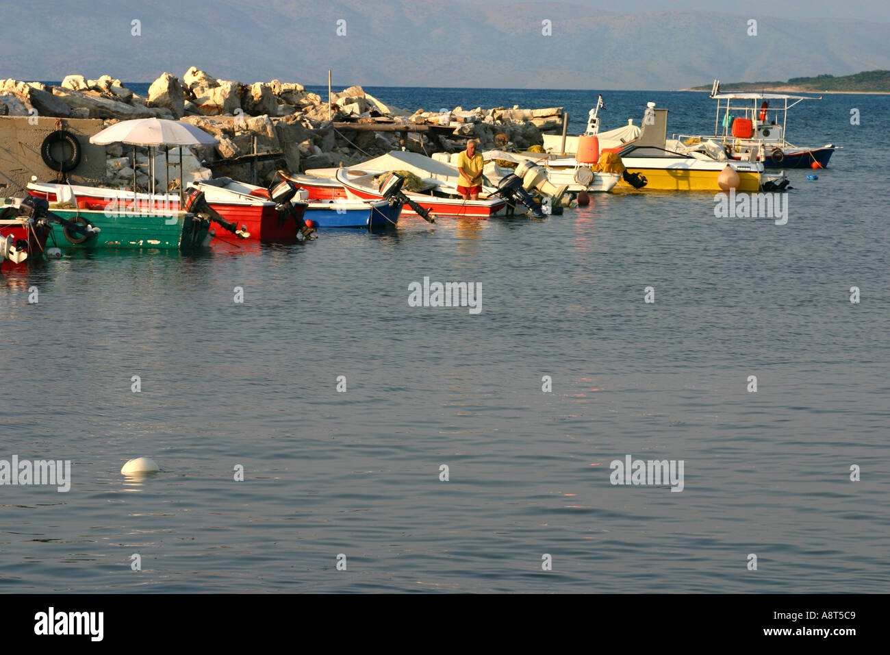 Fishing Boats at Roda Beach in Corfu Stock Photo - Alamy