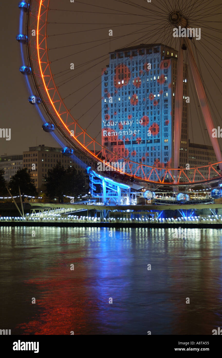 London Eye with Shell Building lit for Rememberence Sunday 2003 Stock ...