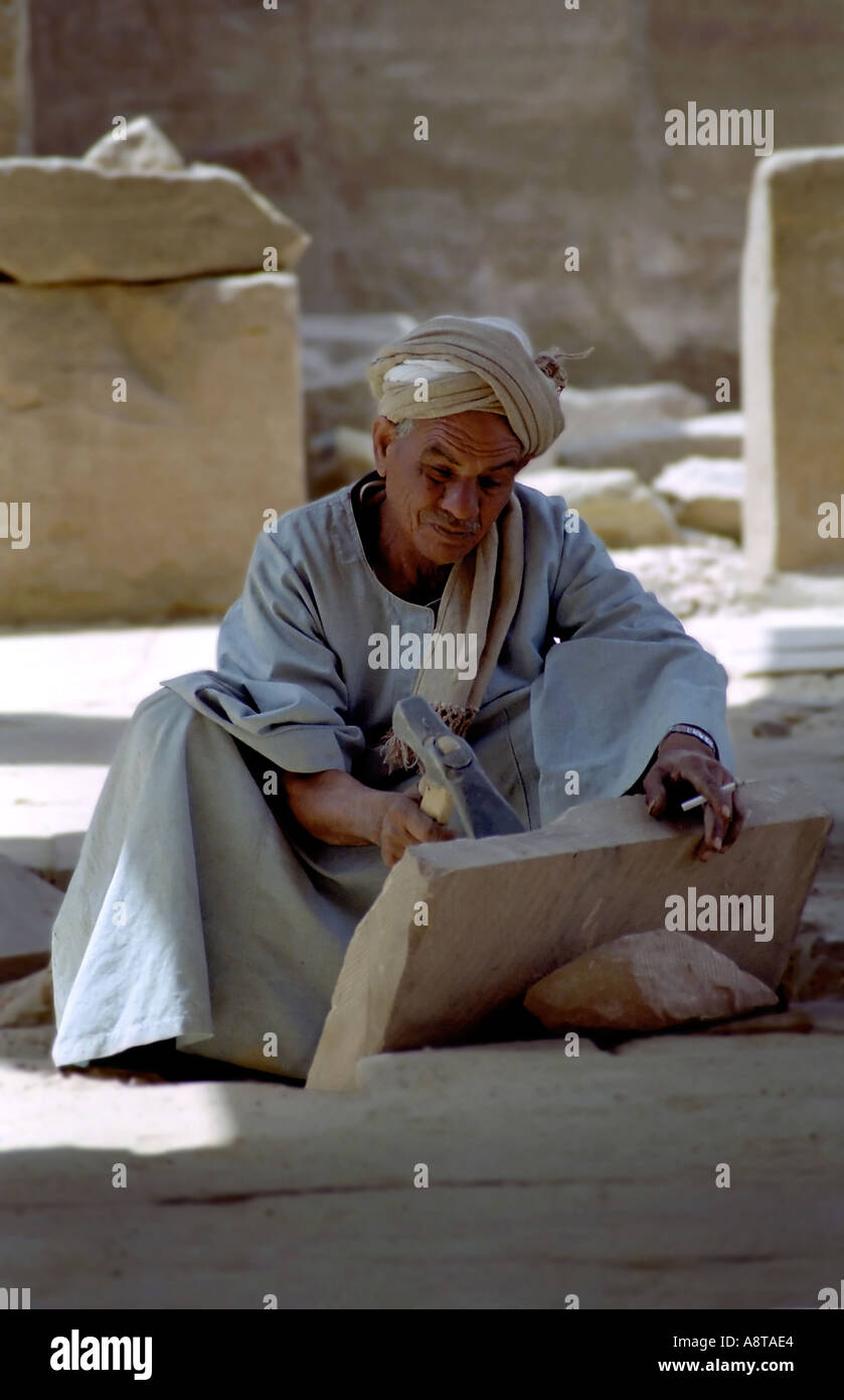 Egyptian stone carver at Karnak Stock Photo - Alamy