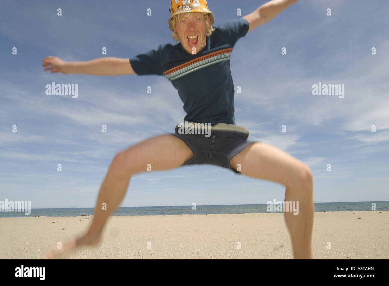 crazy young man on the beach Stock Photo - Alamy
