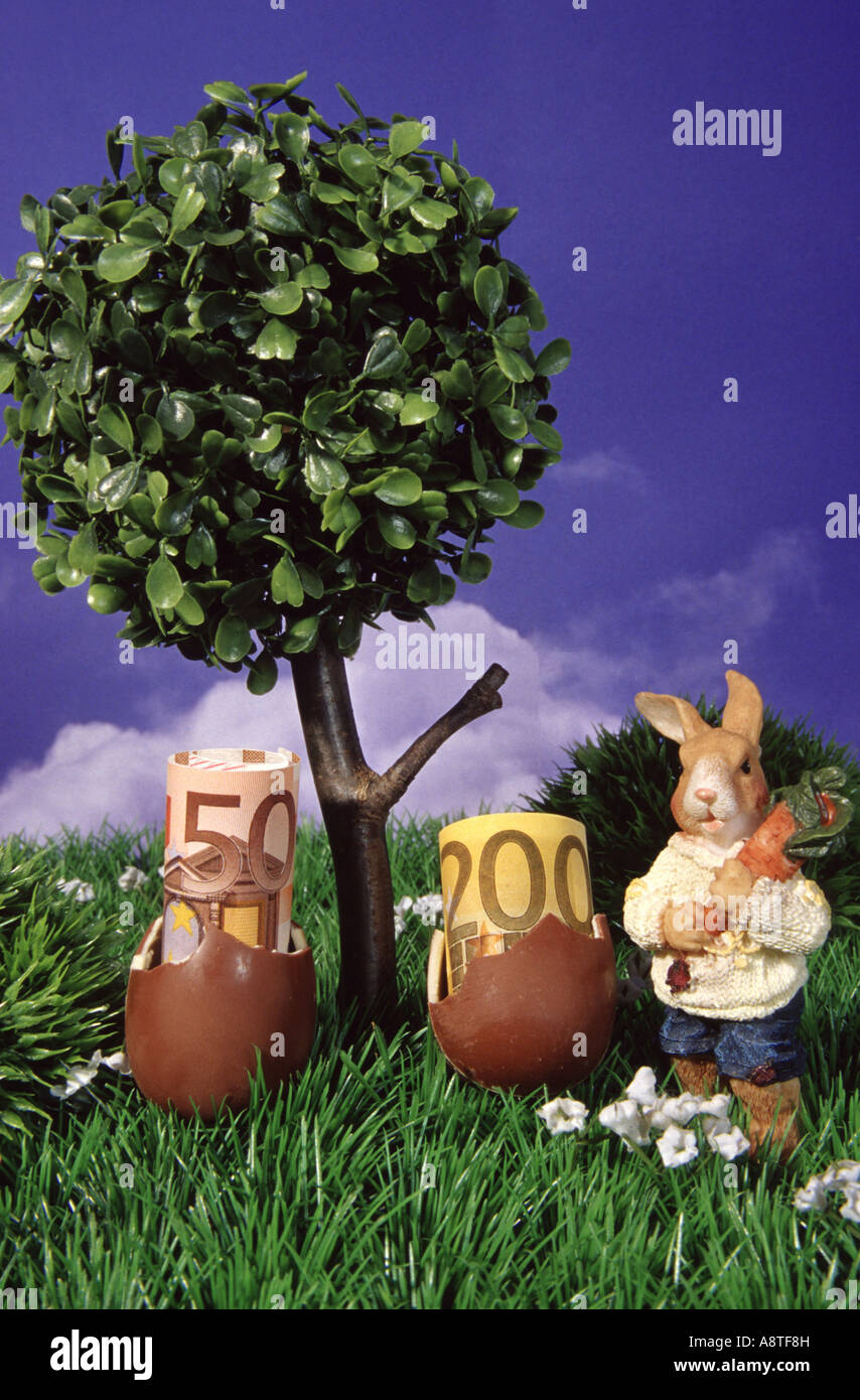 easter bunny with easter eggs filled with banknotes Stock Photo - Alamy
